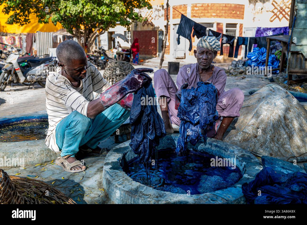 Men dyeing Indigo blue, Kofar Mata Dye Pits, Kano, Nigeria Stock Photo ...
