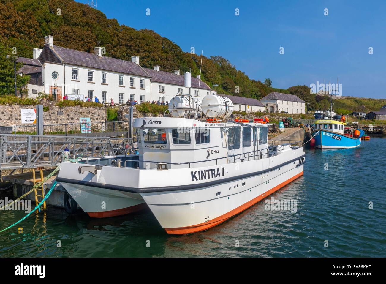 Catamaran moored in harbour, Rathlin Island, County Antrim, Ulster ...