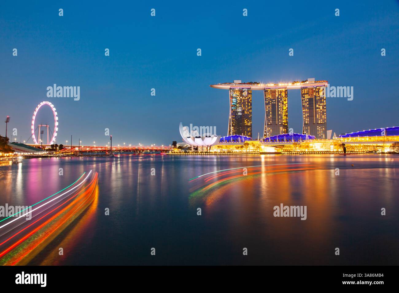 Skyline of Singapore Marina Bay at night with Marina Bay Sands, Art ...