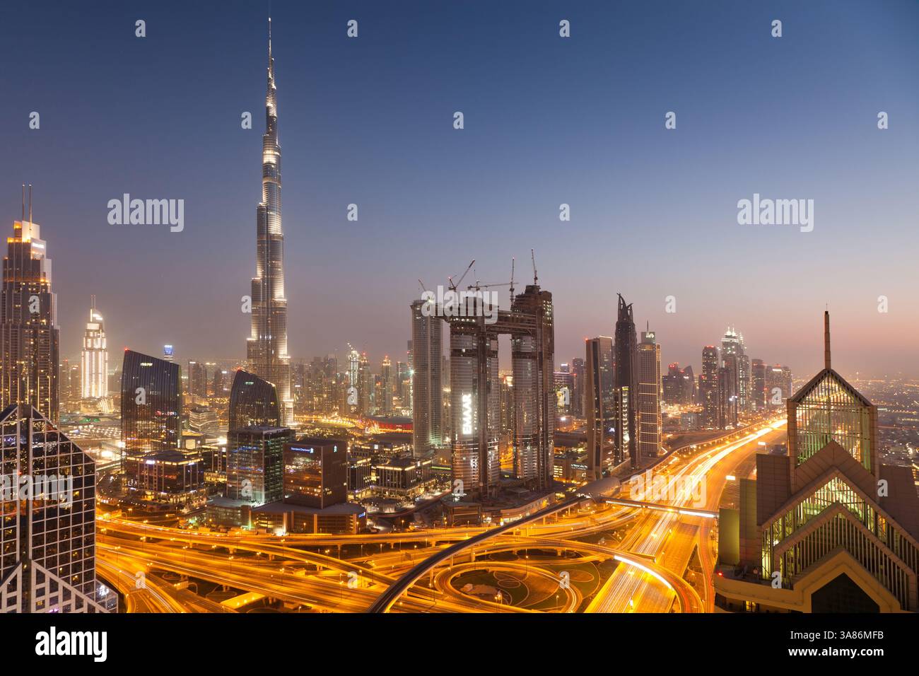 Dubai skyline at sunset with Burj Khalifa, the world tallest building ...