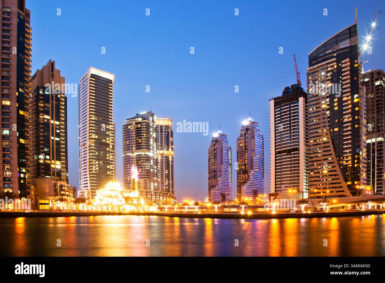 Colorful evening on canal and promenade in Dubai Marina, Dubai, United ...