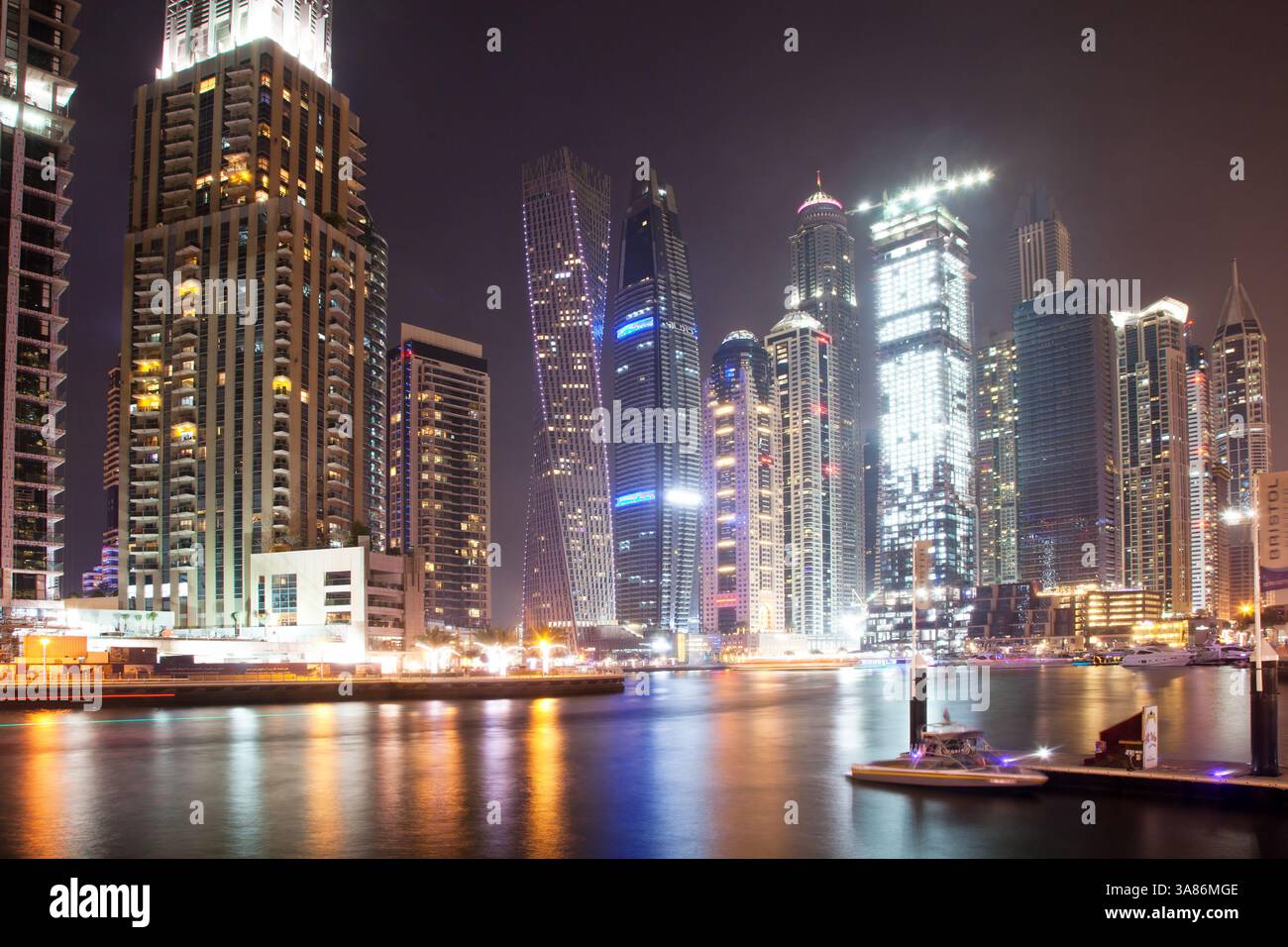 Colorful evening on canal and promenade in Dubai Marina, Dubai, United ...