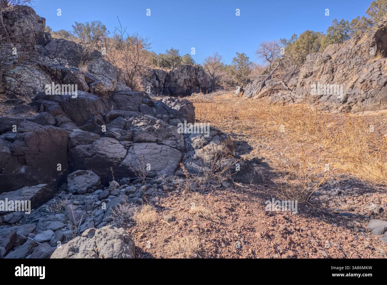 Basalt boulders and cliffs, Johnson Canyon east of Bainbridge Steel Dam ...