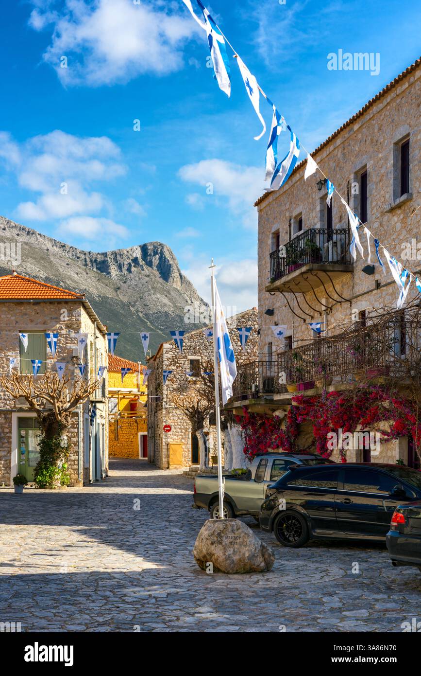 Areopoli historic city center with flags of Greece and Flag of the ...