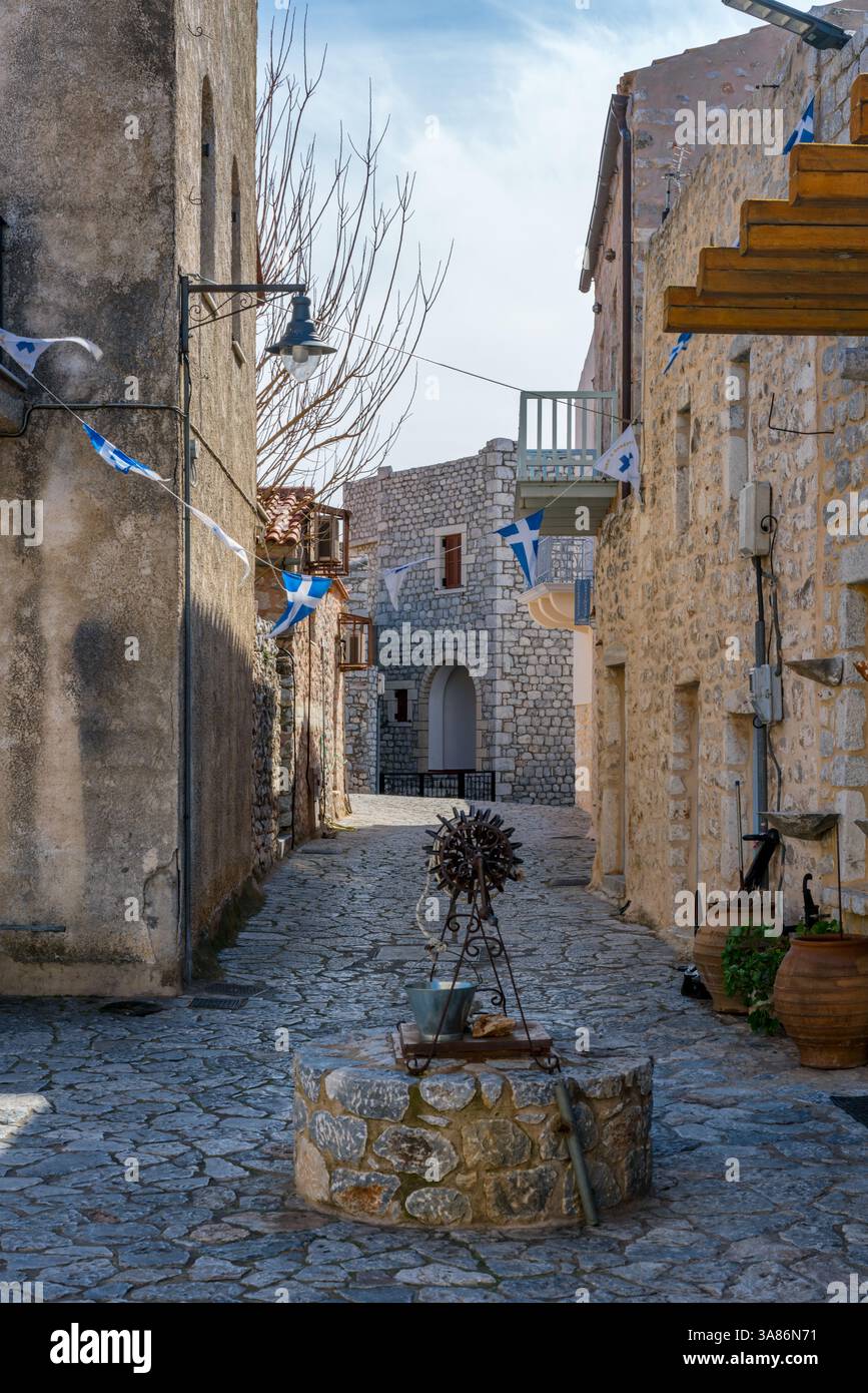 Areopoli historic city center with flags of Greece and Flag of the fighters of the autonomous ...
