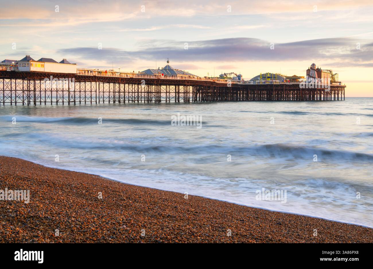 West side of the Brighton Palace Pier at sunset, City of Brighton and ...