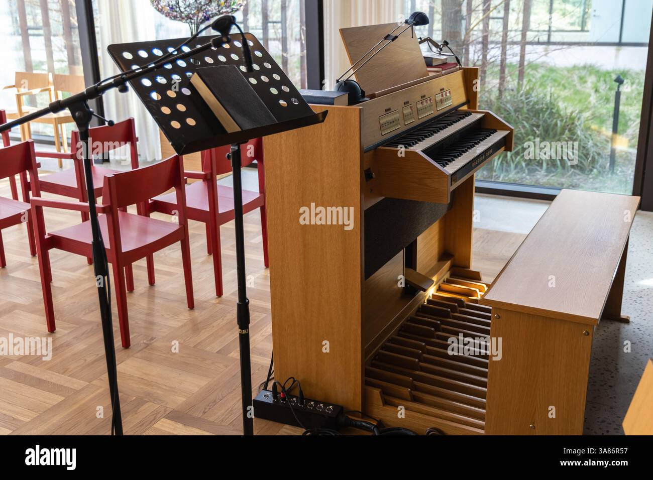 Small indoors pipe organ. Musical instrument for church singing and ...