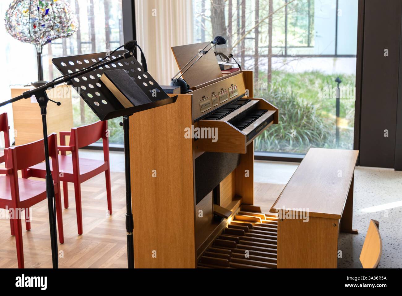Small indoors pipe organ. Musical instrument for church singing and ...