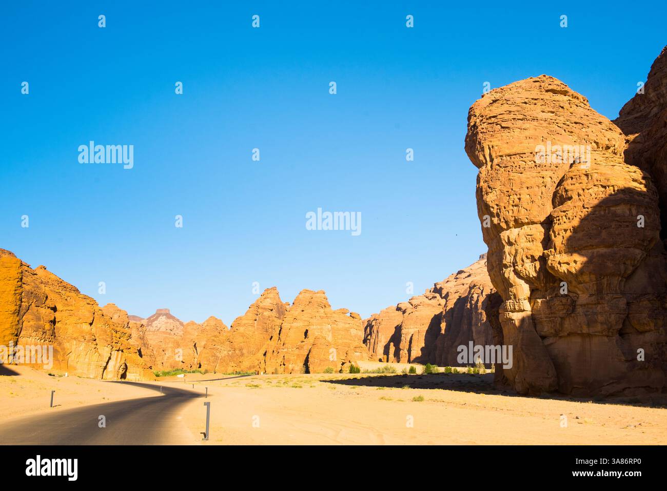 Road through the sandstone rock formations in the desert canyons of the ...