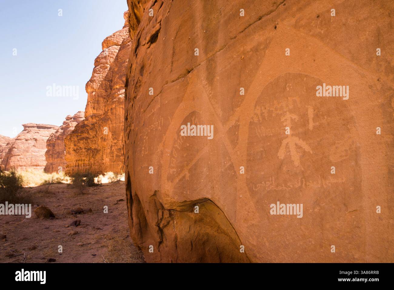 Ancient symbols and rock carvings on a sandstone rock cliff in the ...