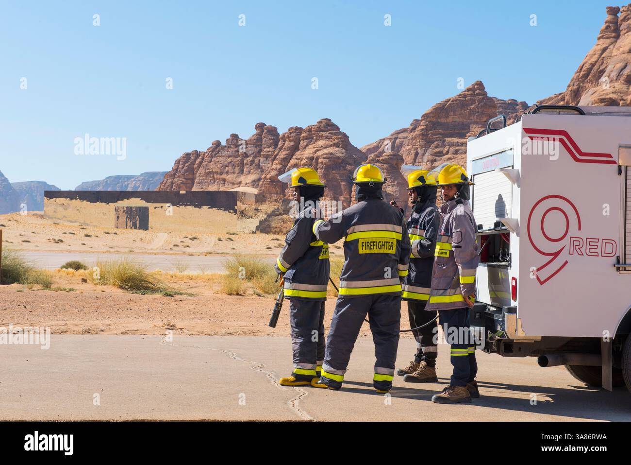 FireFighter team ready to intervene at the landing of a helicopter near ...