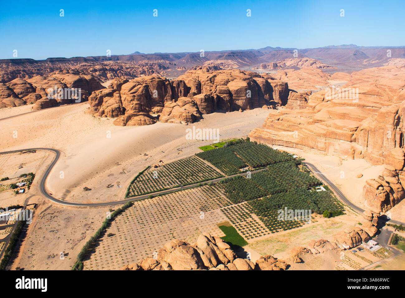 Aerial view from helicopter, of a farm in an ancient oasis in the ...