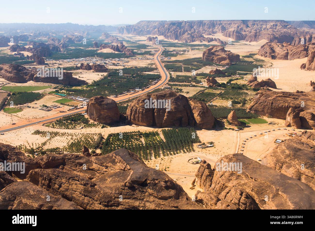 Aerial view, from helicopter, of an ancient oasis in the desert with ...