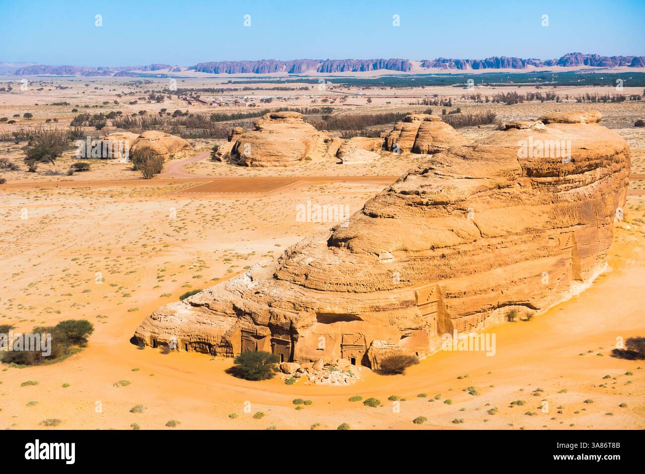 Aerial of tombs carved in sandstone rock of Jabal Banat (Qasr al-Bint ...