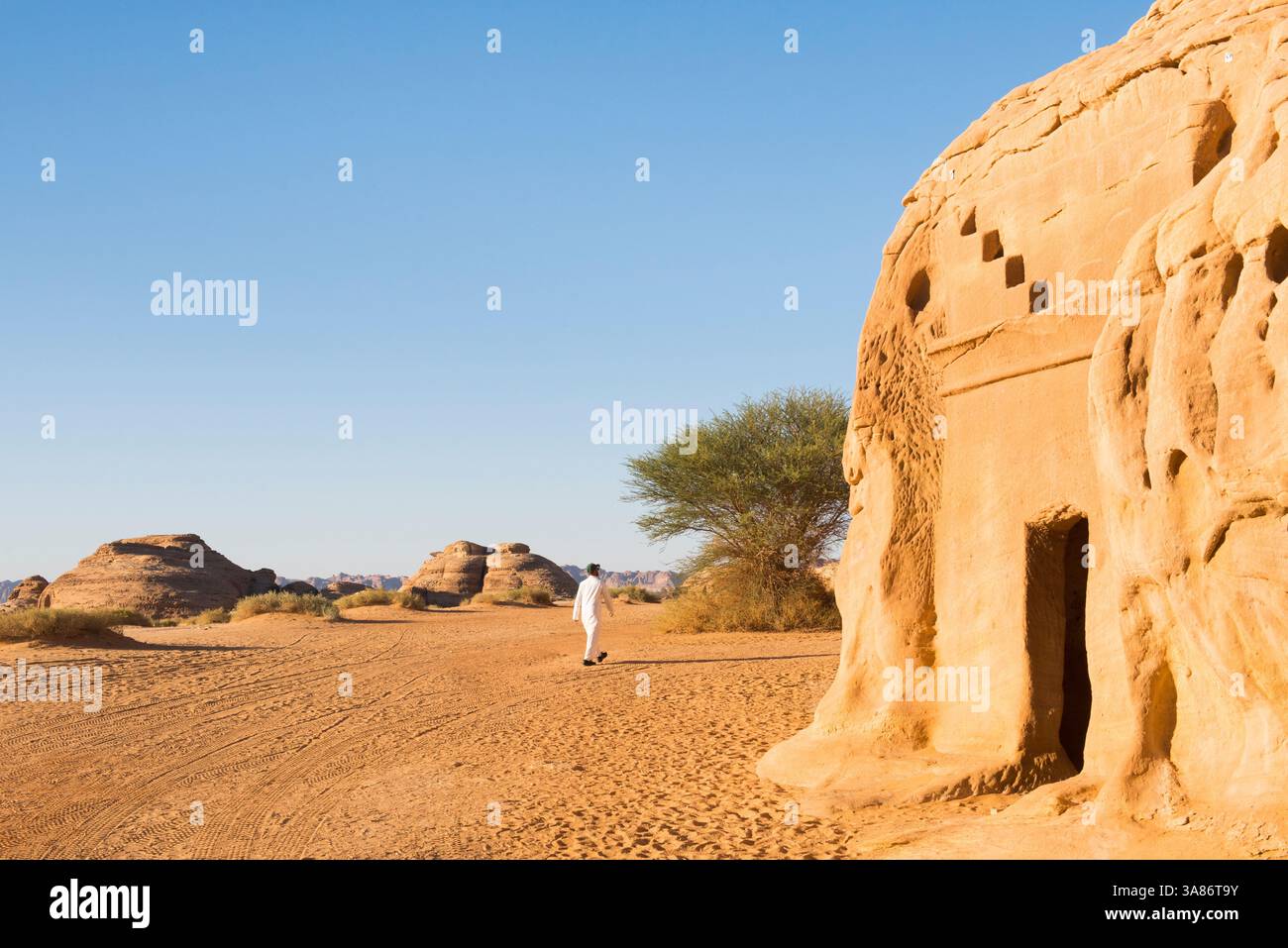 Tombs carved into sandstone rock of Jabal Banat (Qasr Al-Bint) area in ...