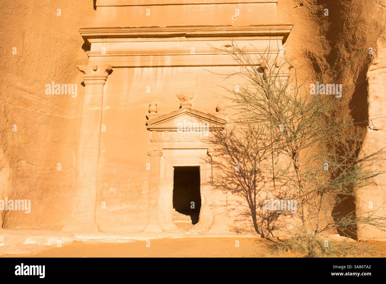 Tombs carved into sandstone rock of Jabal Banat (Qasr Al-Bint) area in ...