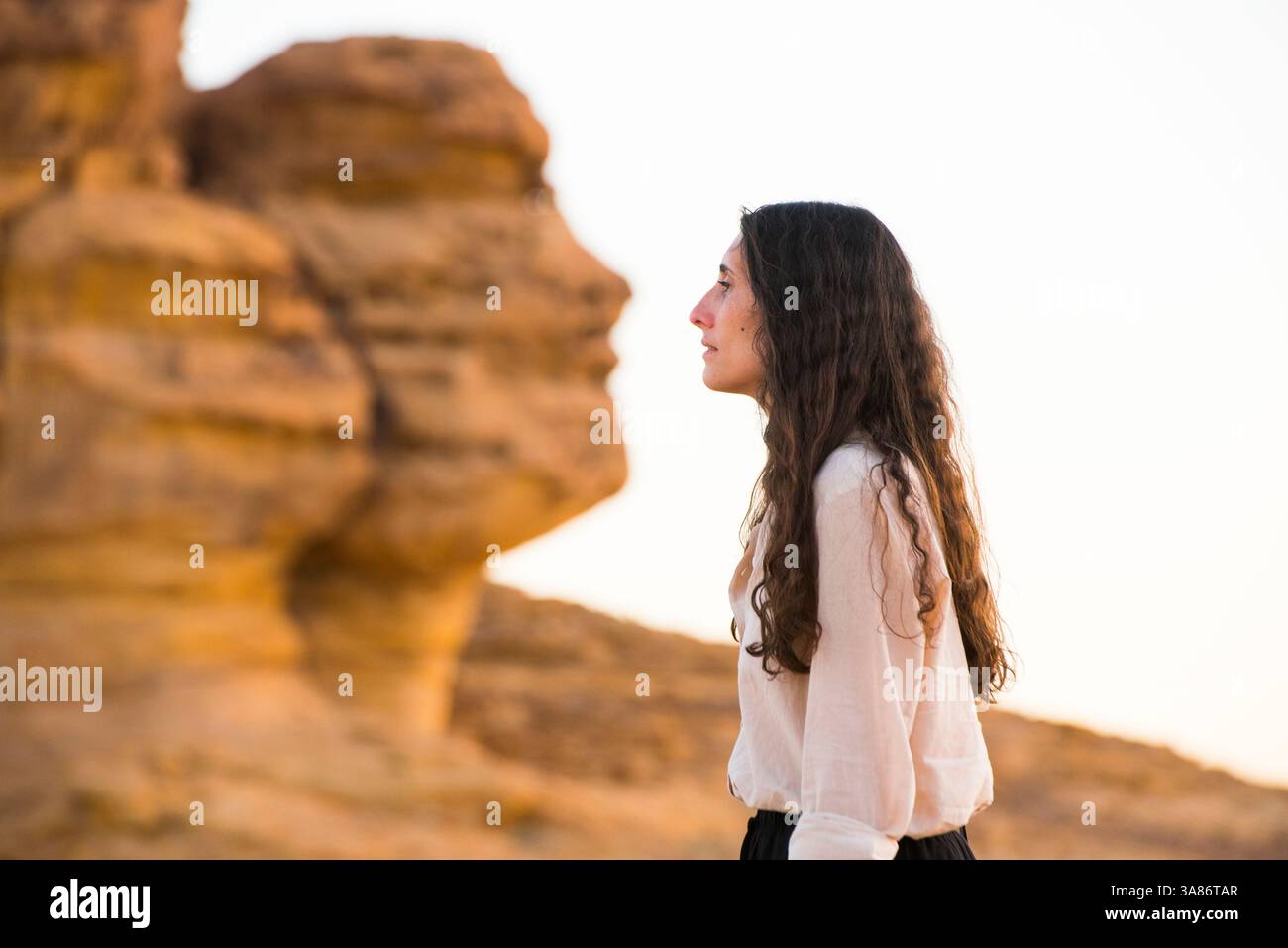 Woman in front of Face Rock, a sandstone rock formation in shape of ...