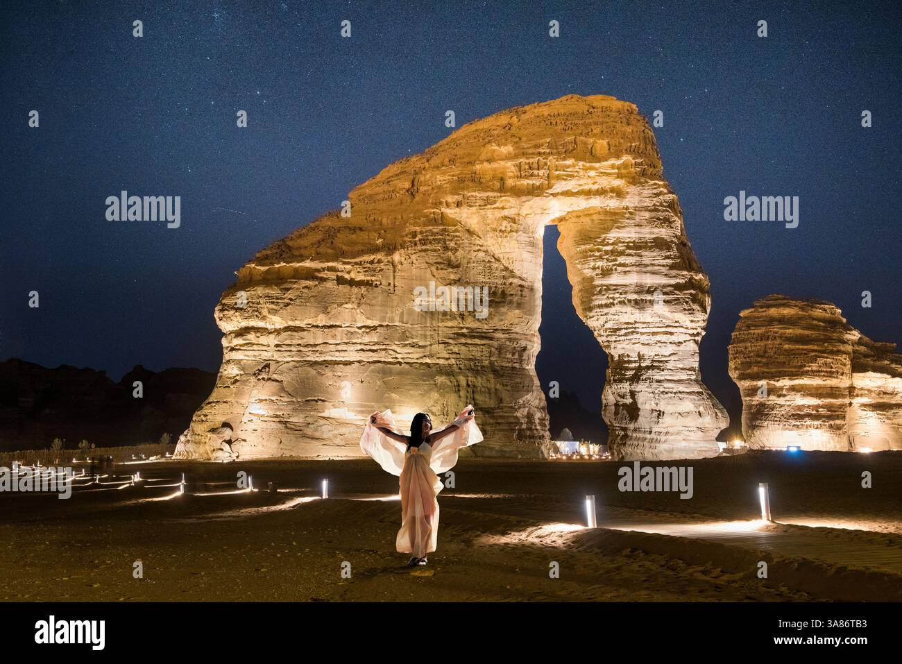 Jabal Alfil (Elephant Rock) by night, a natural red sandstone formation ...