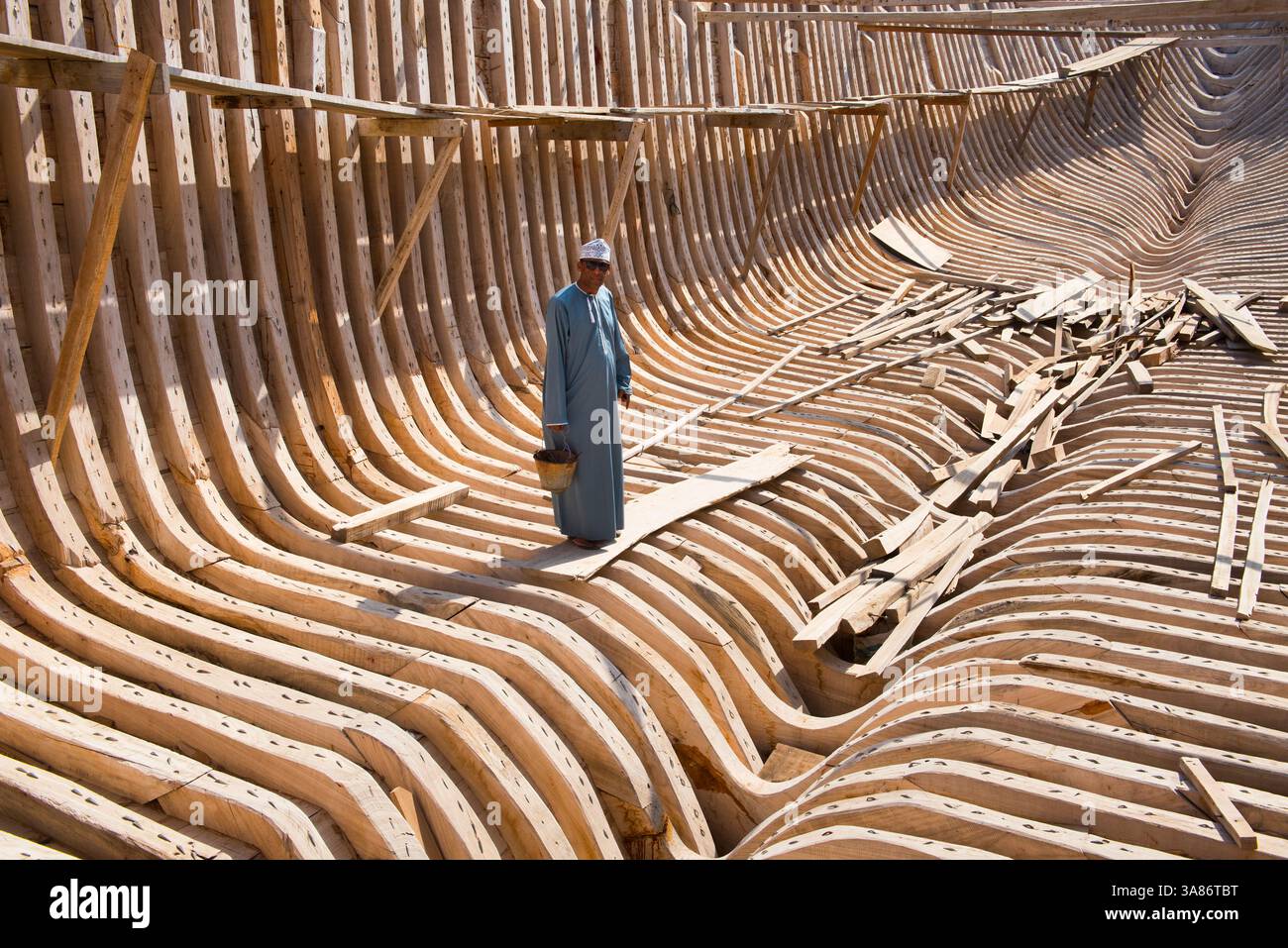 Inner structure in teak wood of a dhow under construction in ...