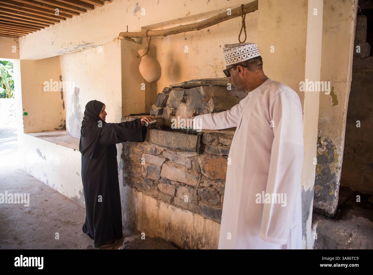 Fountain in the palm grove of the village of Misfat (Misfah) Al ...