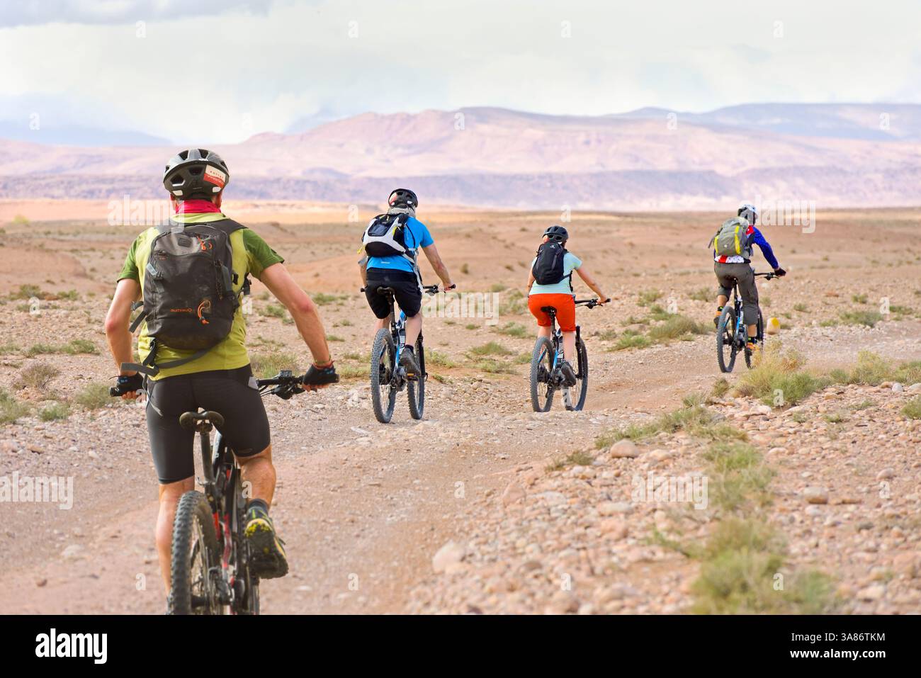 Electric mountain bike riders on track between Ouarzazate and Ait Ben Haddou, Ounila River ...