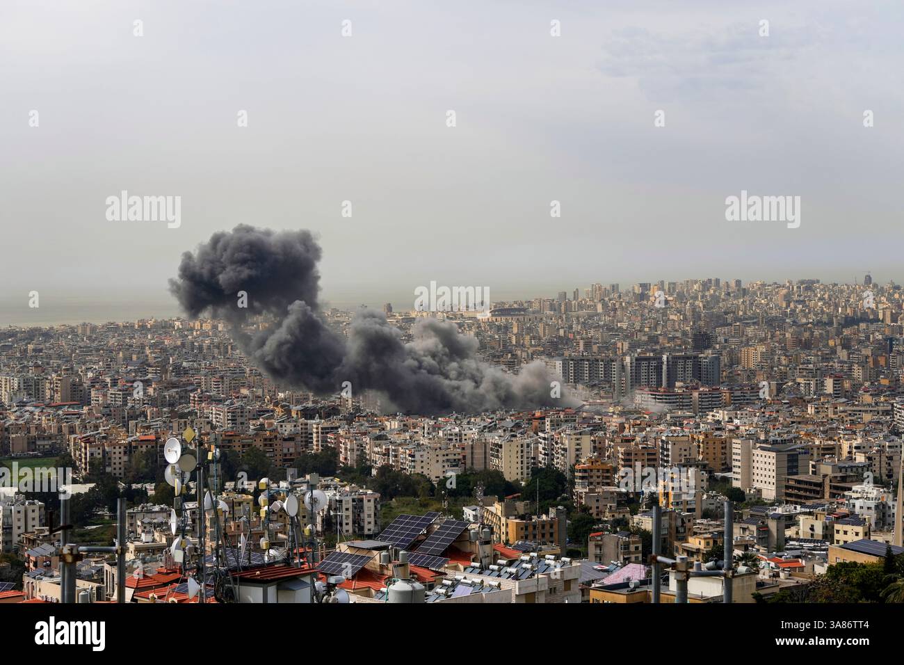 Smoke rises following an Israeli airstrike on Dahiyeh, in the southern ...