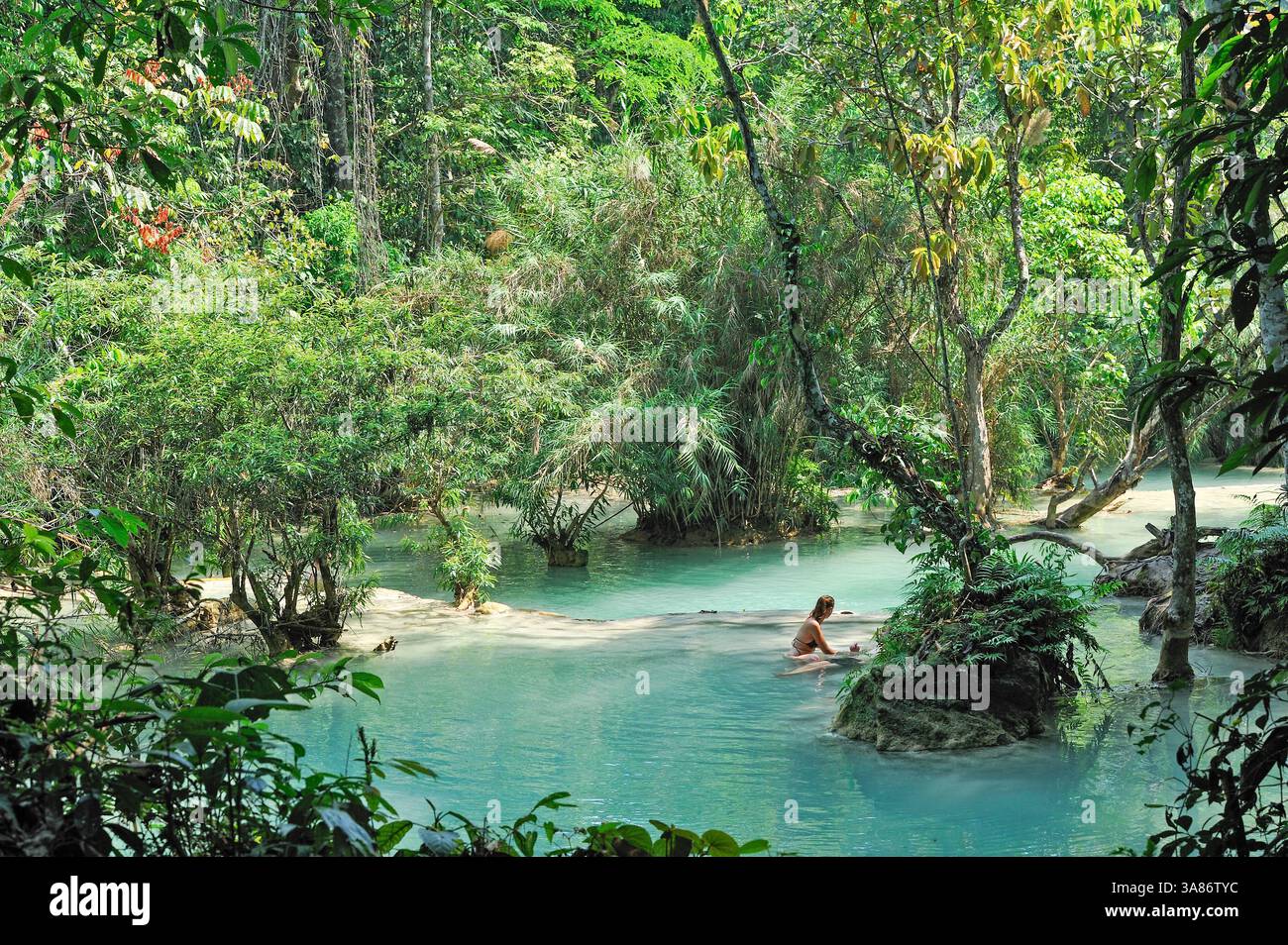 Couple bathing at Kuang Si waterfalls, Luang Prabang, Laos Stock Photo ...