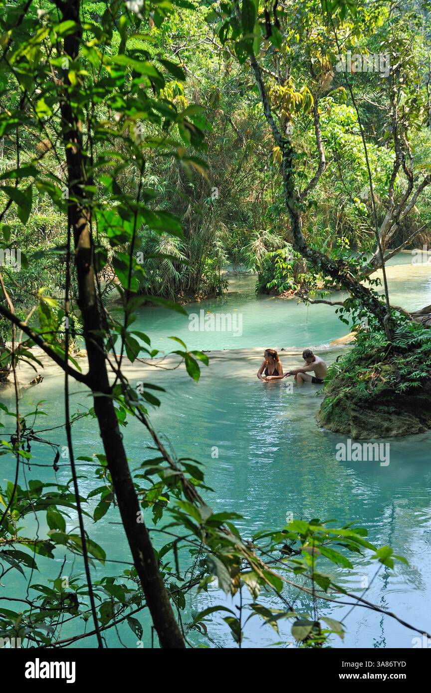 Couple bathing at Kuang Si waterfalls, Luang Prabang, Laos Stock Photo ...