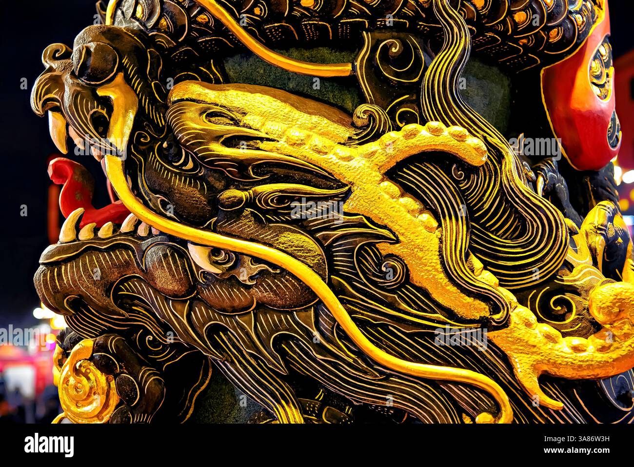 Exquisite carvings of dragons on the pillars at the temple of the ...