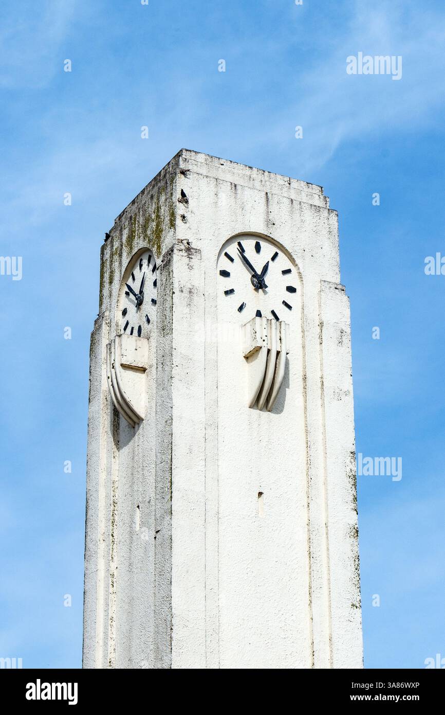 Tall white art deco clock tower with two clock faces part of seaton ...