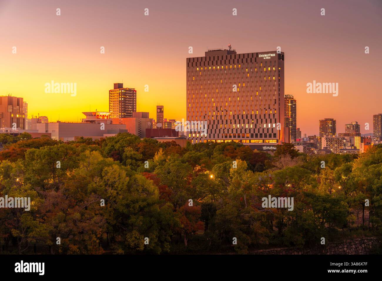 View of Osaka skyline from Osaka Castle at sunset, Osakajo, Chuo Ward ...