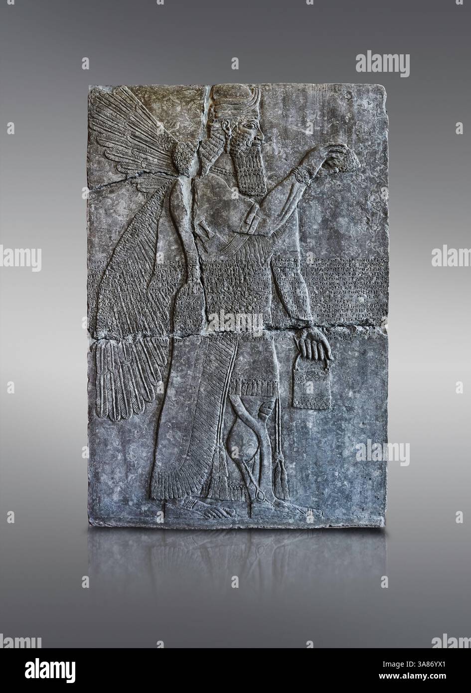 Ancient Neo Assyrian palace relief sculpture depicting a bearded Winged ...