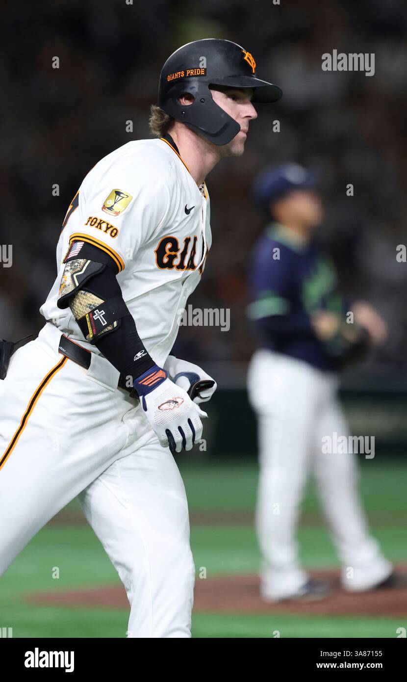 Yomiuri Giants' Trey Cabbage of USA reacts hitting a two-run homer in ...