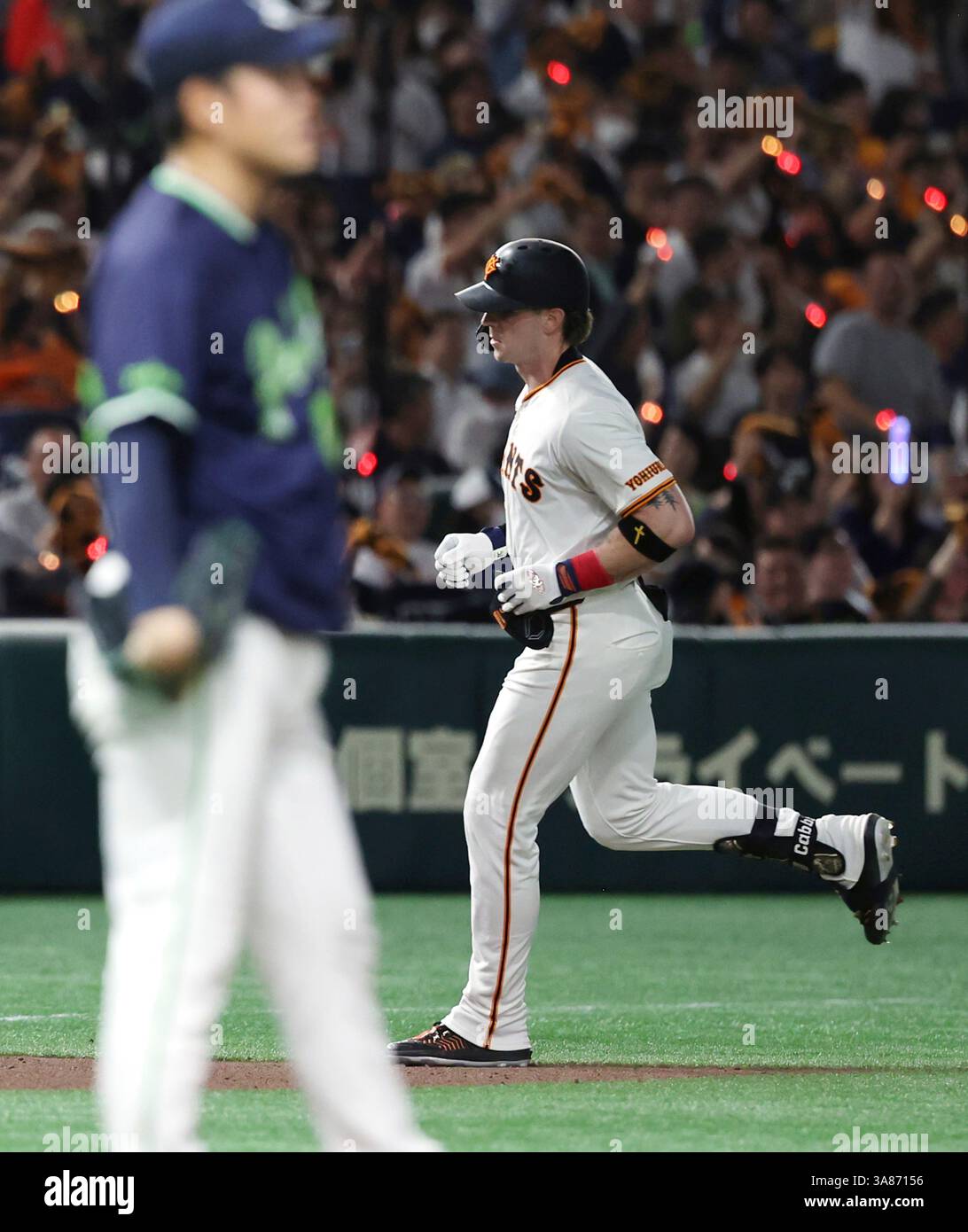 Yomiuri Giants' Trey Cabbage of USA reacts hitting a two-run homer in ...