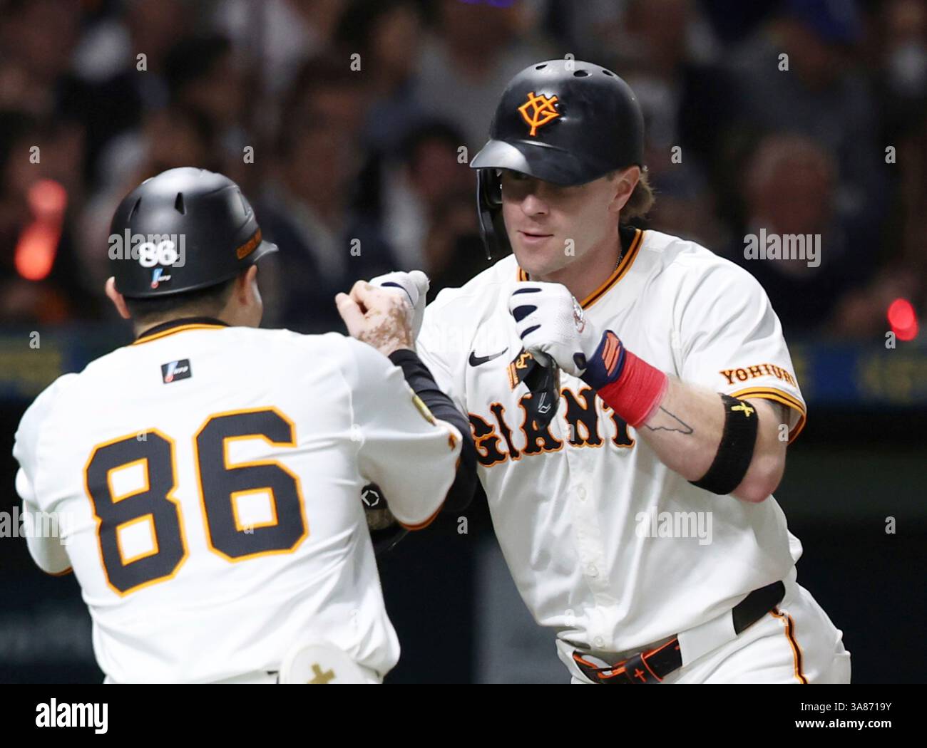 Yomiuri Giants' Trey Cabbage of USA reacts hitting a two-run homer in ...