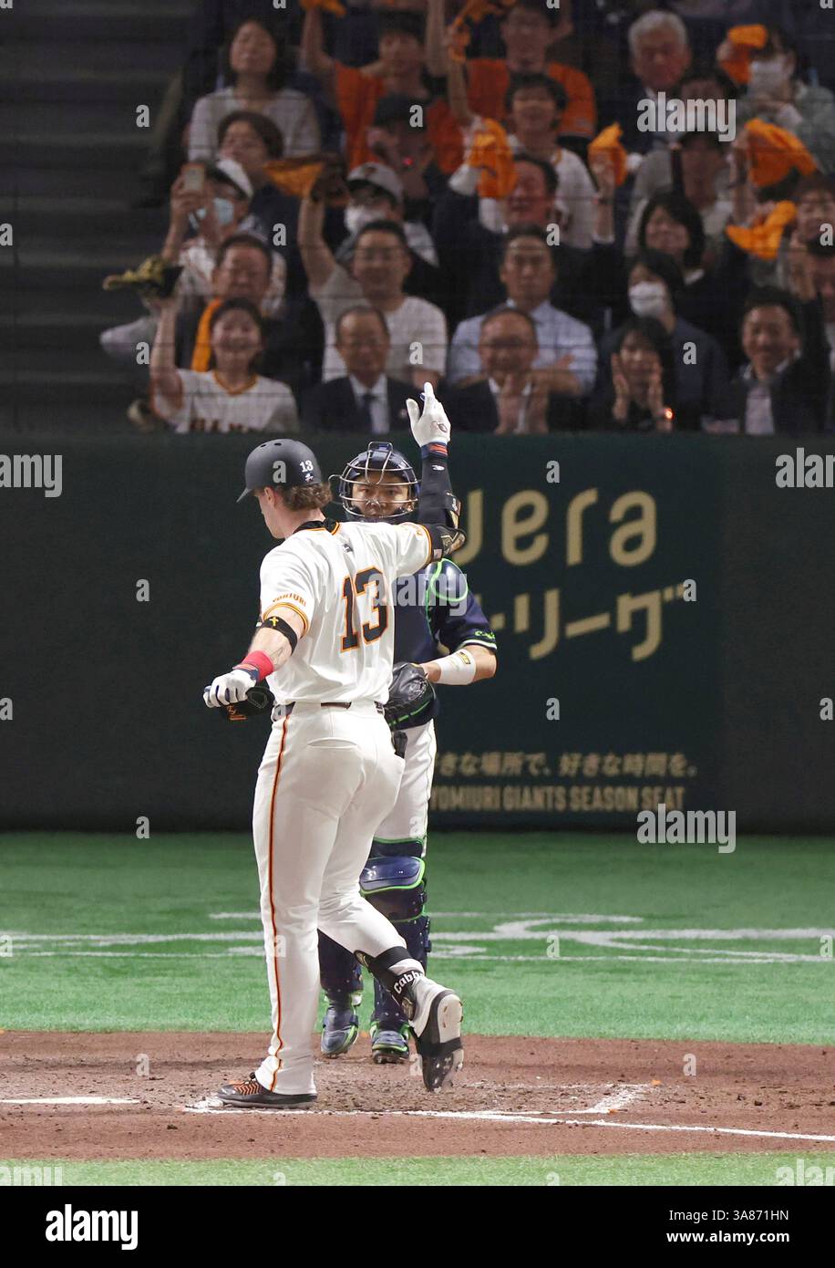 Yomiuri Giants' Trey Cabbage of USA reacts hitting a two-run homer in ...