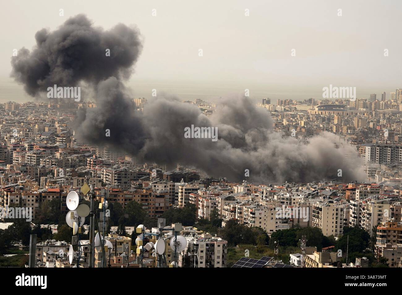 Smoke rises following an Israeli airstrike on Dahiyeh, in the southern ...