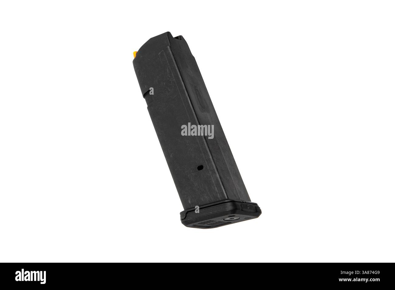 A black pistol magazine with an orange follower, isolated on a white ...