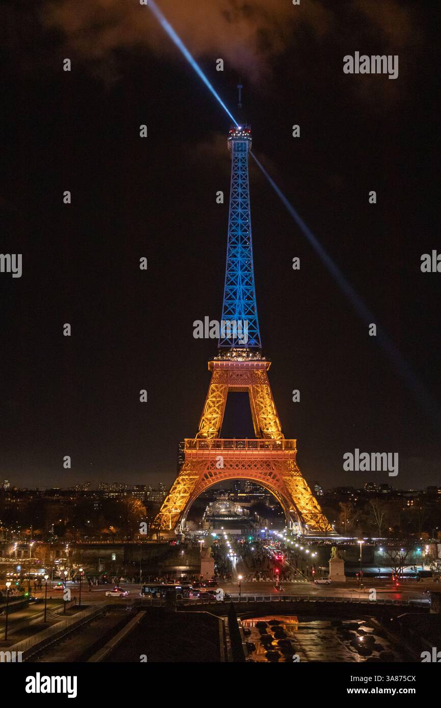 Paris, France - February 24, 2025: the Eiffel Tower stands illuminated ...