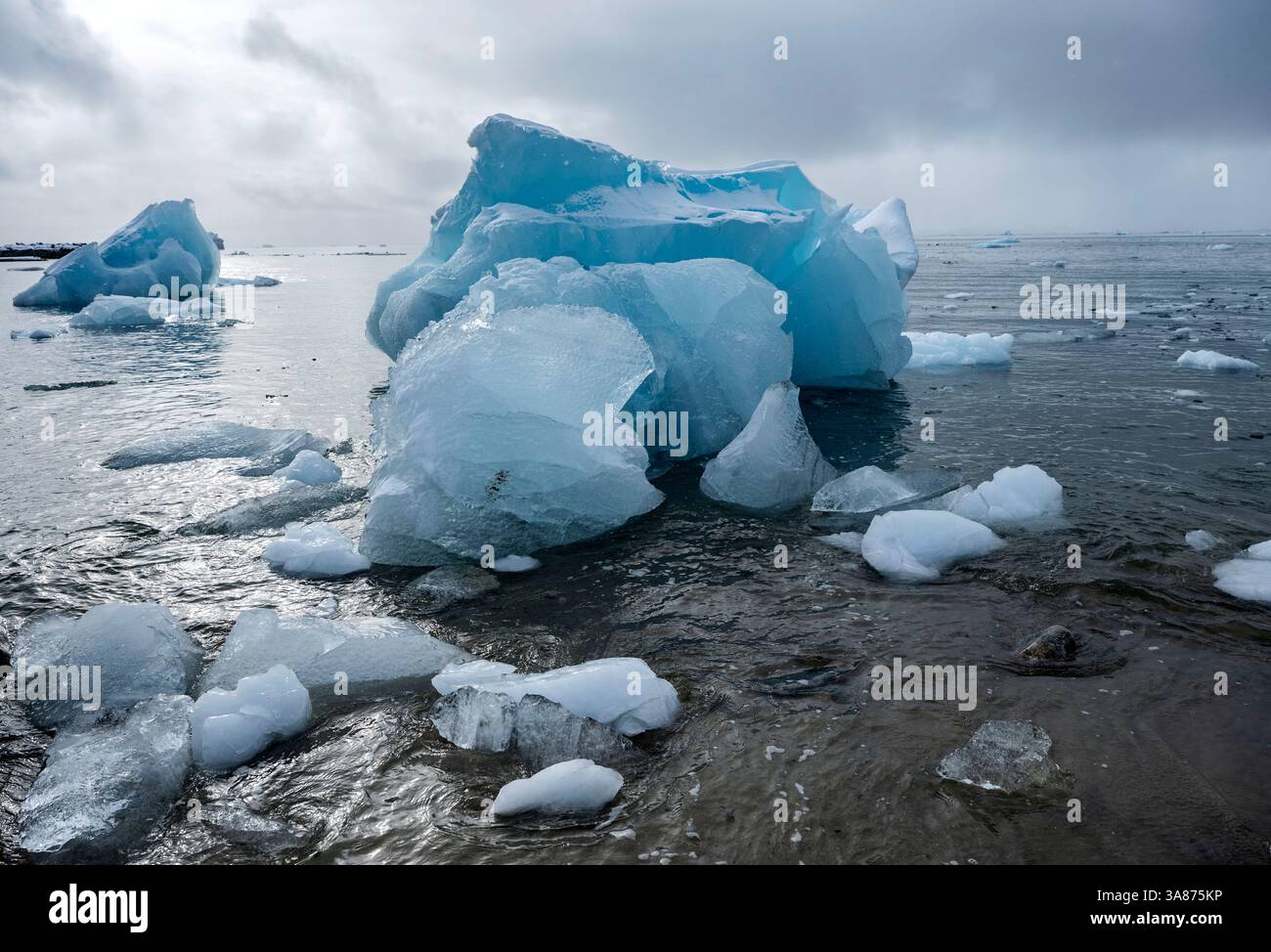 Nuuk, Greenland. 27th Mar, 2025. Iceberg washed up on the beach at The ...