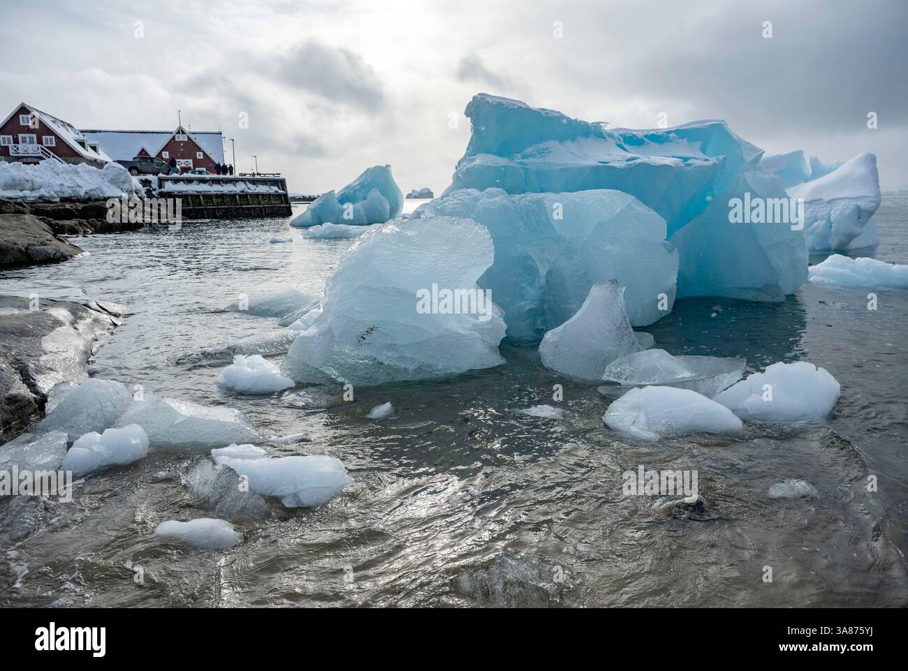 Nuuk, Greenland. 27th Mar, 2025. Iceberg washed up on the beach at The ...