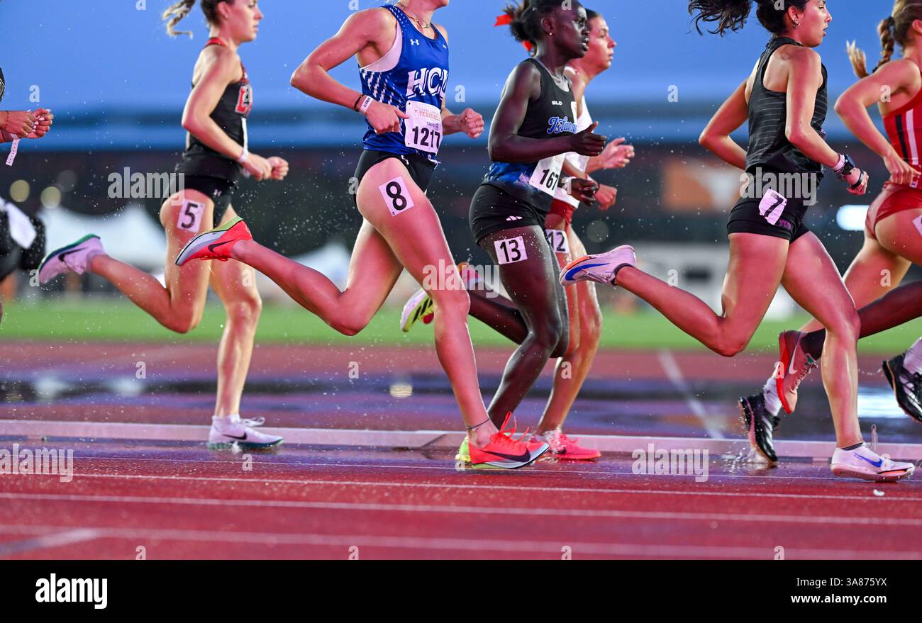 Competitors round the final turn in the women's 1500-meter run section ...