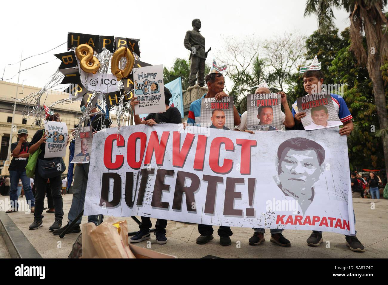 Activists hold signs against former Philippine President Rodrigo ...
