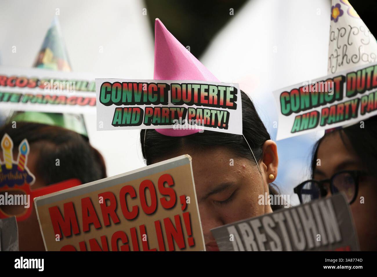Activists wear signs against former Philippine President Rodrigo ...