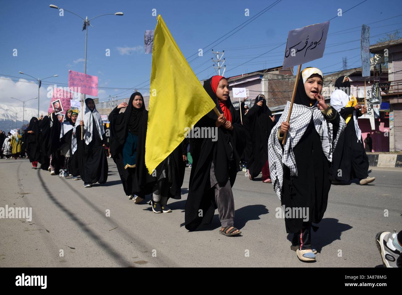 On March 28, 2025, Kashmiri girls carrying flags and posters marched ...