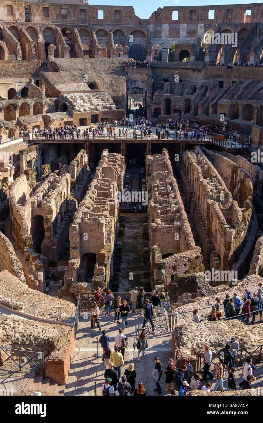 Tourists explore the interior of the ancient Colosseum in Rome, Italy ...