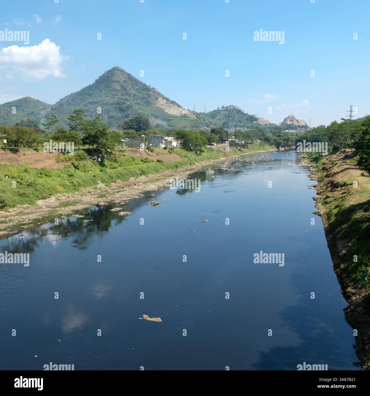 Pollution, including floating trash and discolored water, is visible in ...