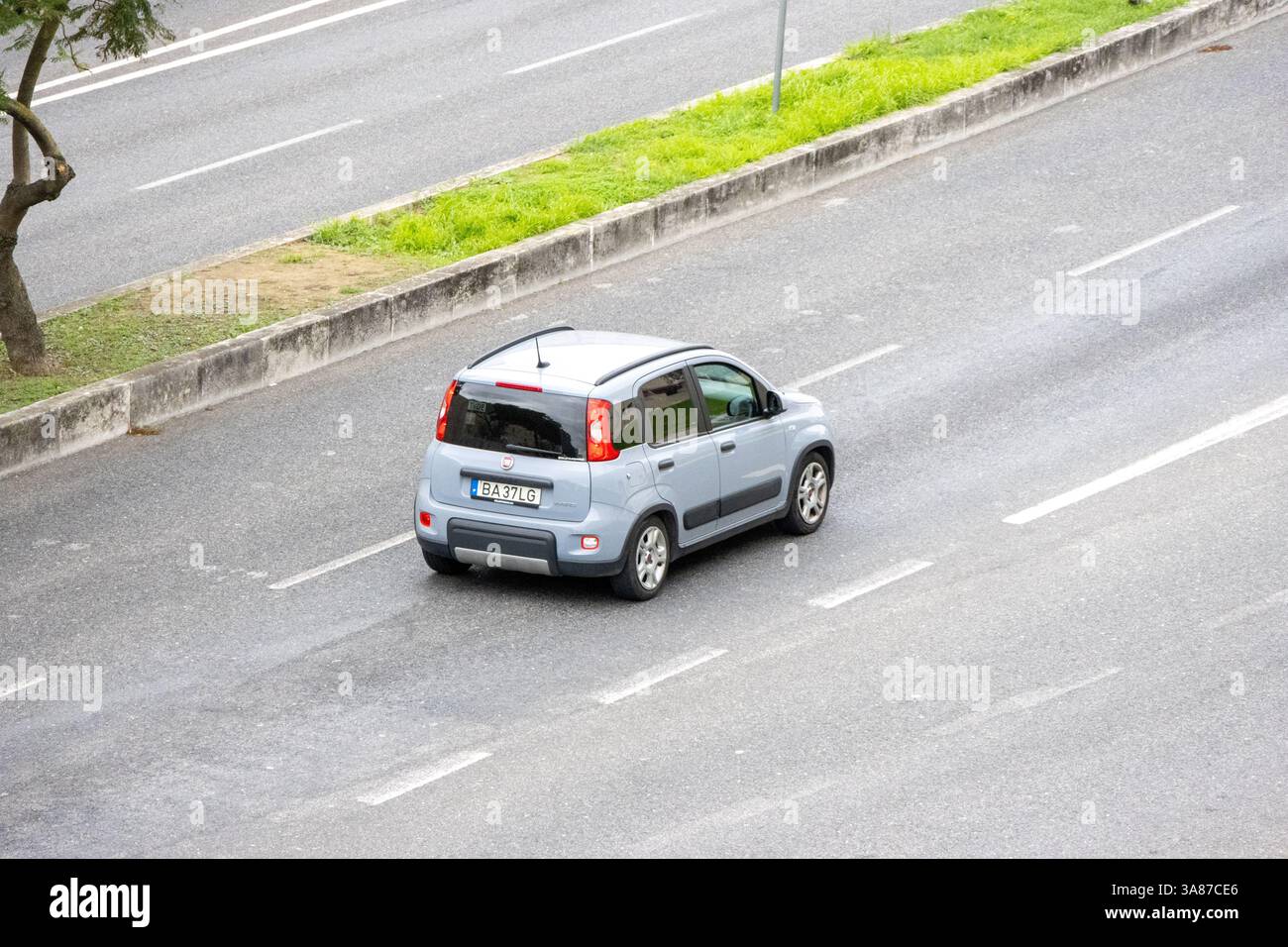 Modern compact car driving on a multi lane highway Stock Photo - Alamy