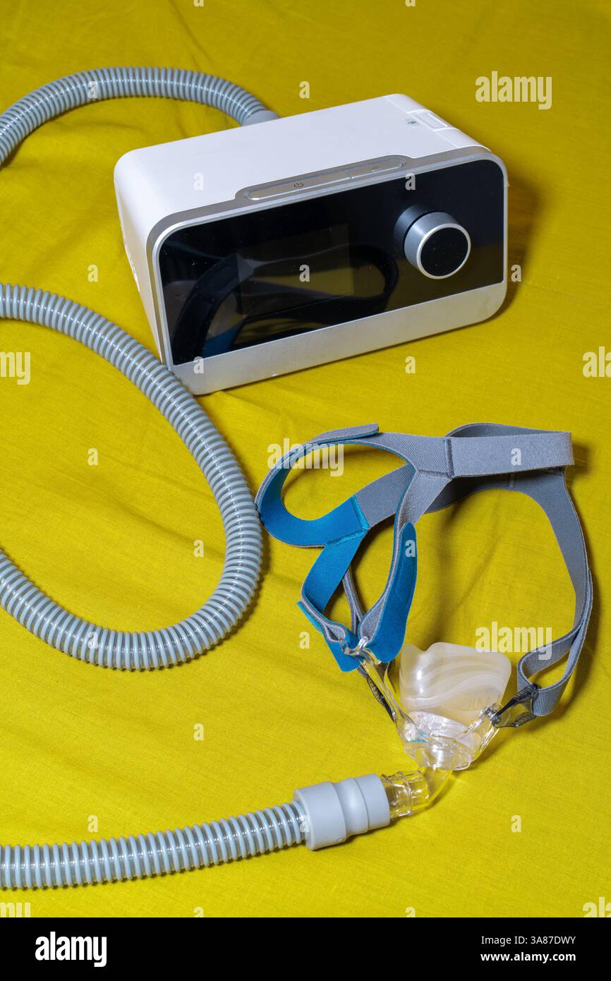 Obstructive Sleep Apnea cpap machine on a yellow surface Stock Photo ...
