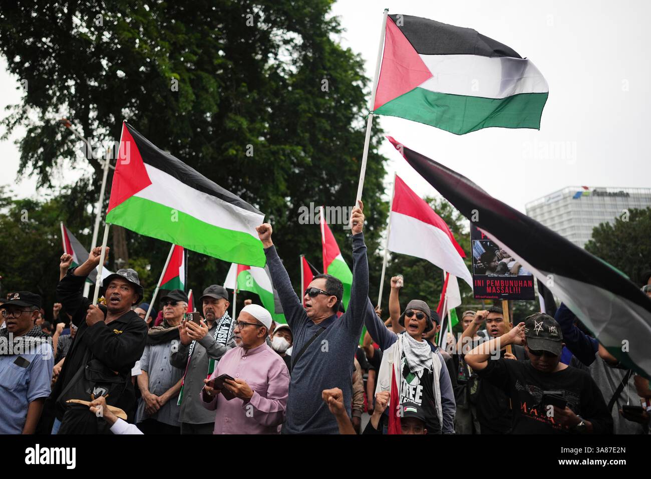 Muslims wave Palestinian flags during the annual Al-Quds Day rally to ...